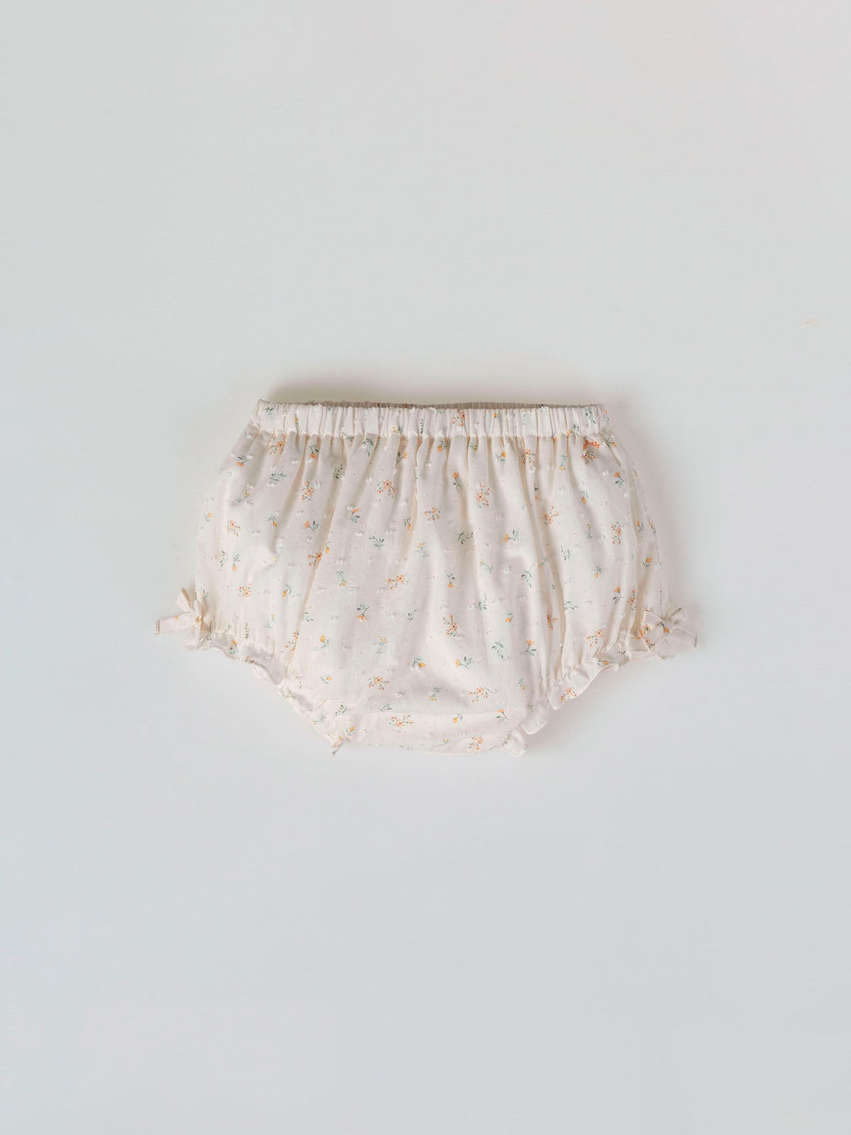 Ranita de plumetti estampado y lazos blanco roto